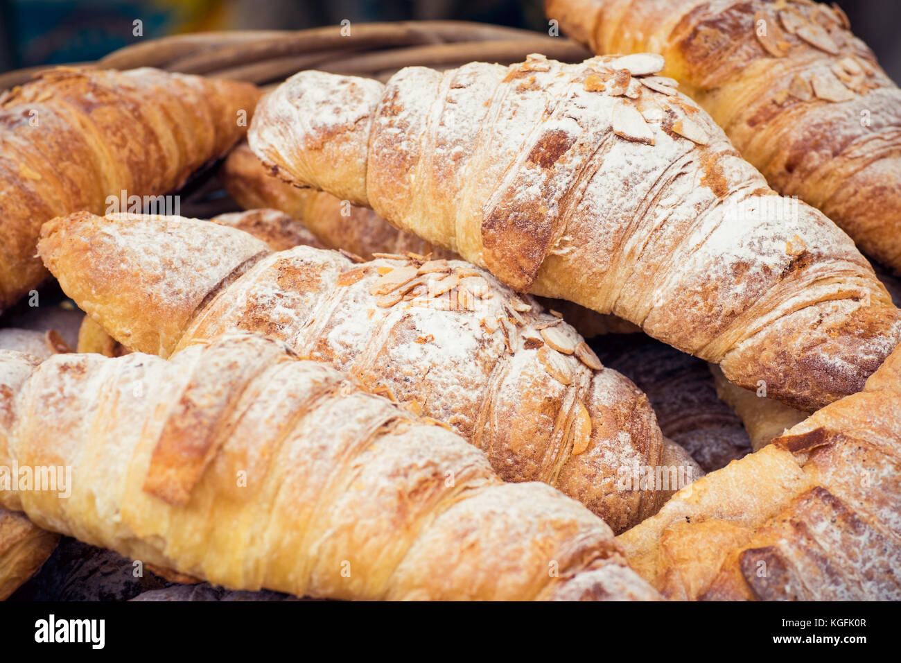 Homemade Almond Croissants in basket, food market display Stock Photo ...