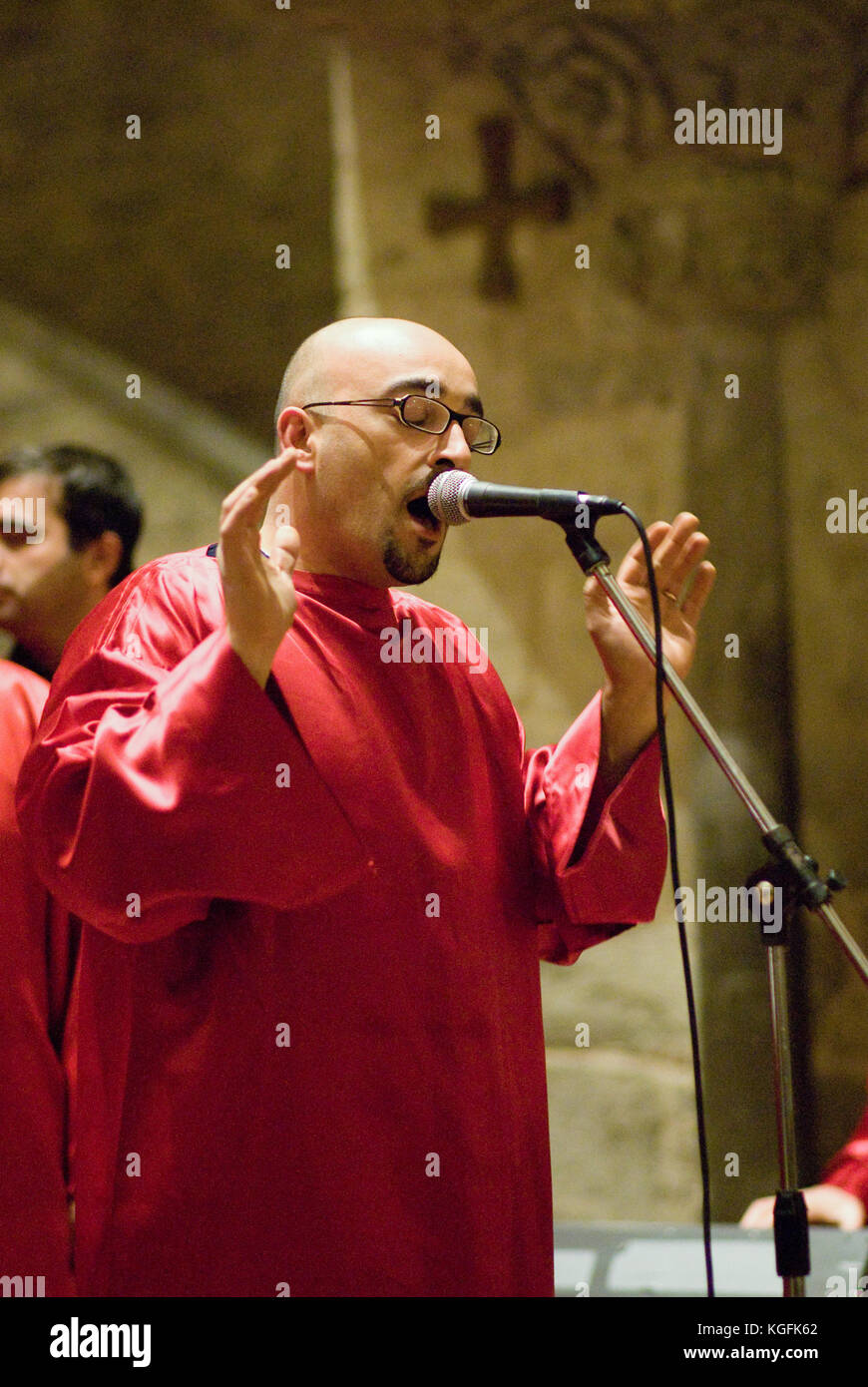 Mature man sings a Gospel performance in a roman church on the hills ...