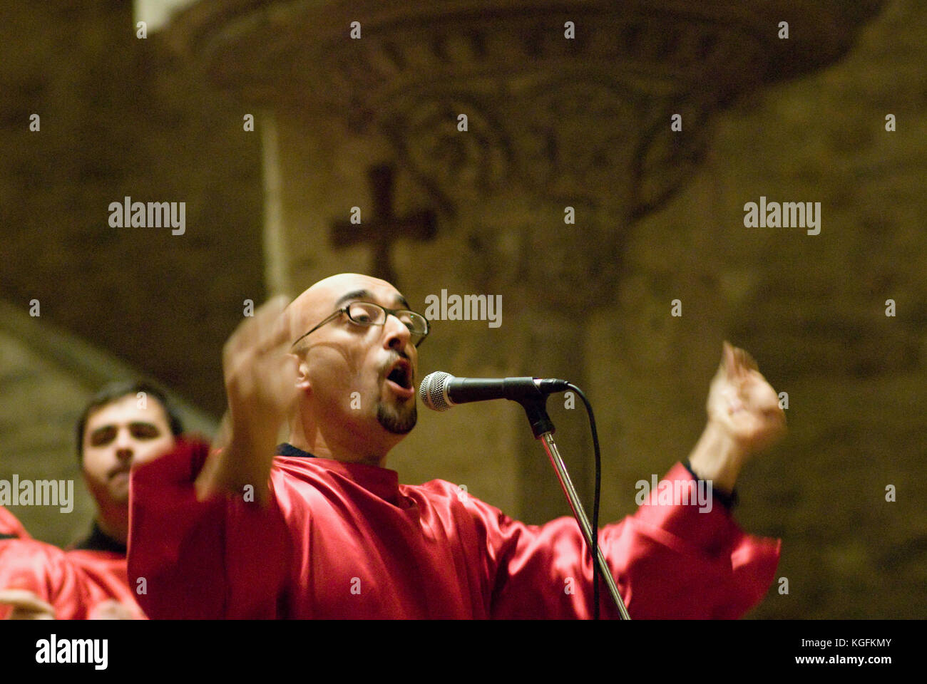 Mature man sings a Gospel performance in a roman church on the hills ...