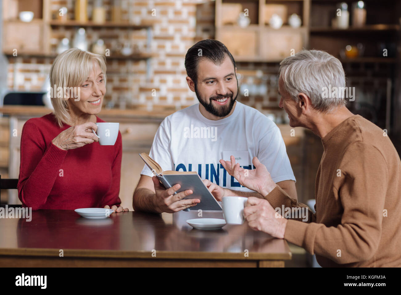 People of different age enjoying reading together Stock Photo - Alamy