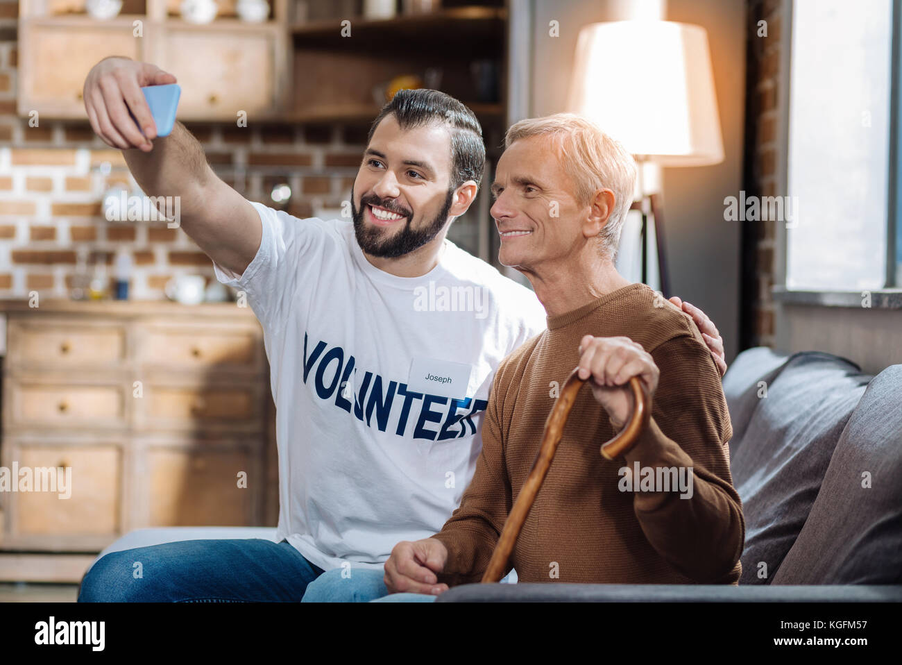 Happy men of different age taking a photo together Stock Photo - Alamy