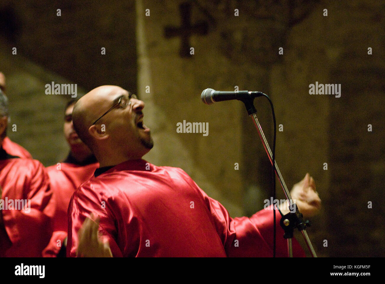 Mature man sings a Gospel performance in a roman church on the hills ...