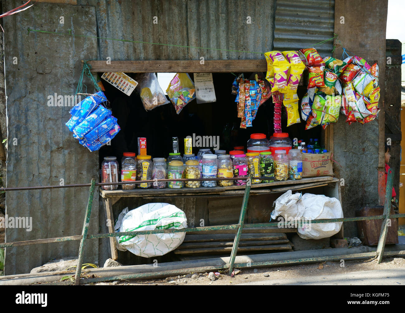 Small store with typical goods of candy and chips in sheet metal shak ...