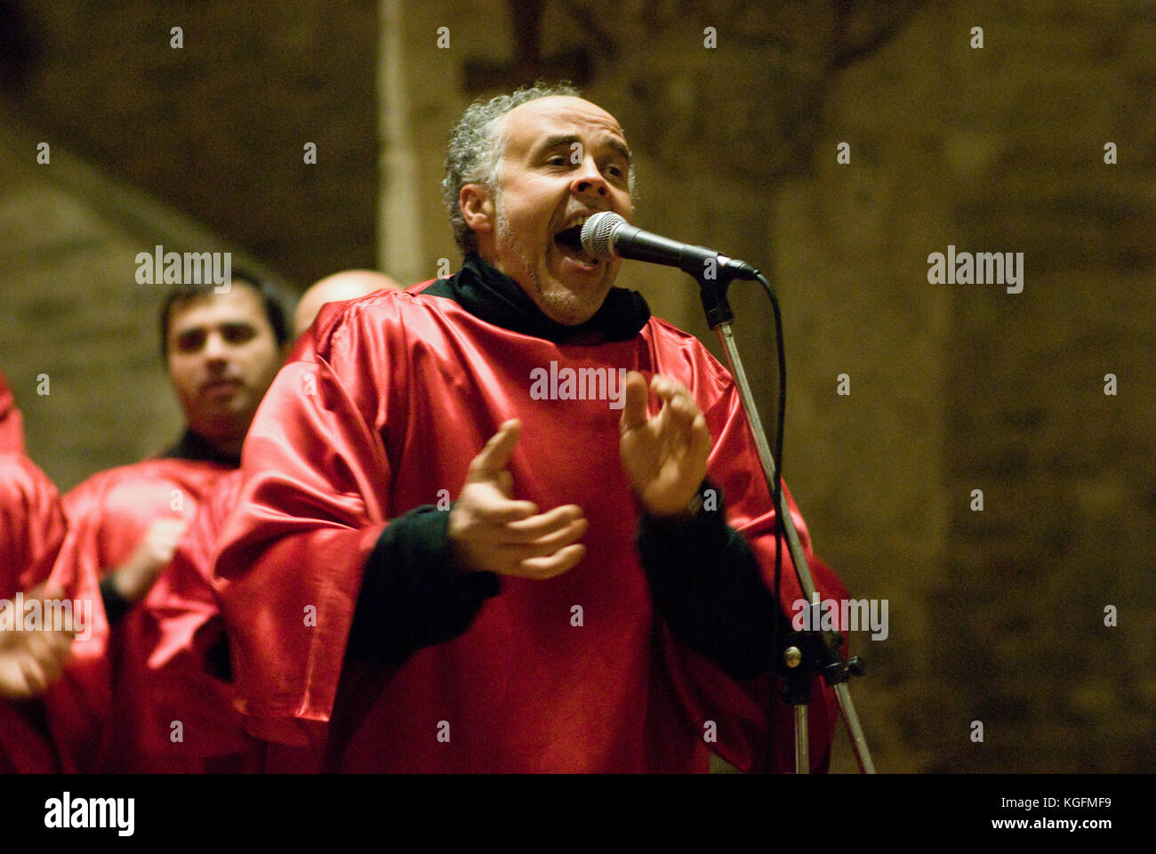 Mature man sings a Gospel performance in a roman church on the hills ...