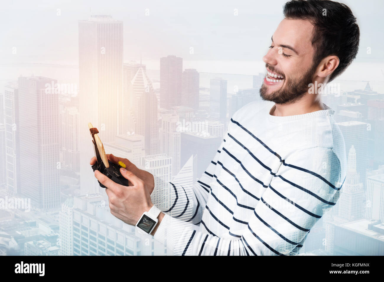 Funny emotional man playing an exciting game Stock Photo - Alamy