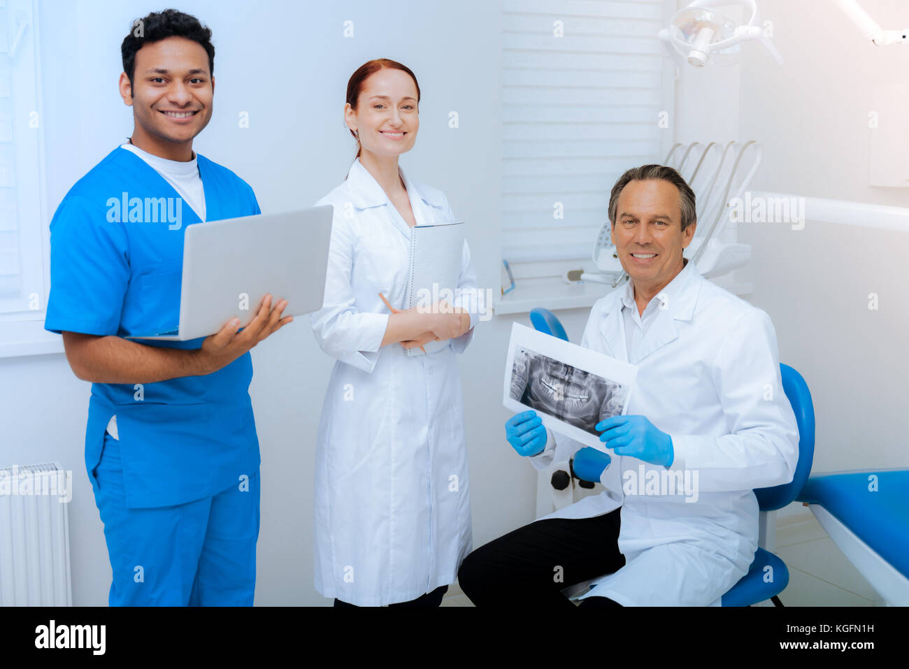 Cheerful medical team working together Stock Photo - Alamy