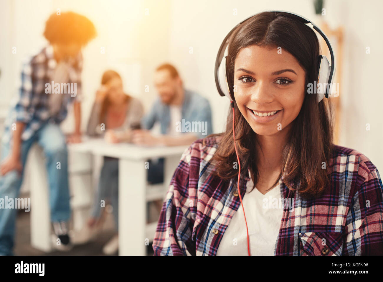 Beautiful smiling student in headphones Stock Photo - Alamy