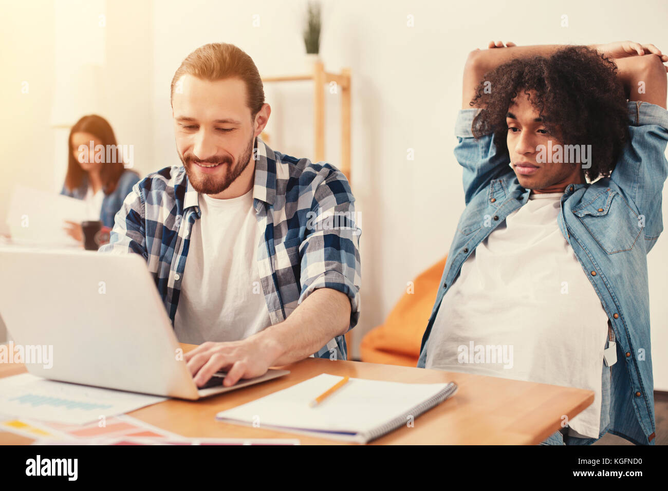 Two young men working in a library Stock Photo - Alamy