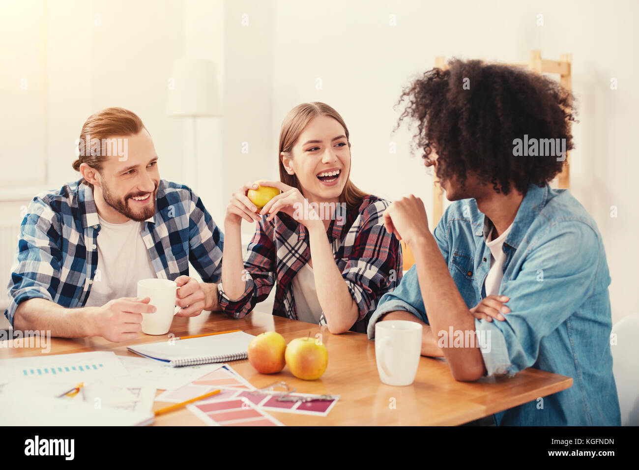 Three best friends sitting together and laughing Stock Photo - Alamy