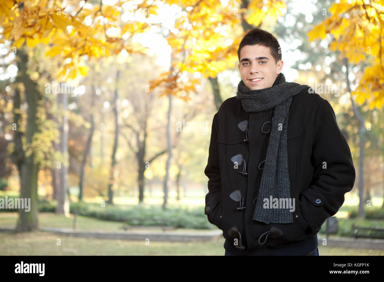 Freezing man standing in autumn park Stock Photo - Alamy