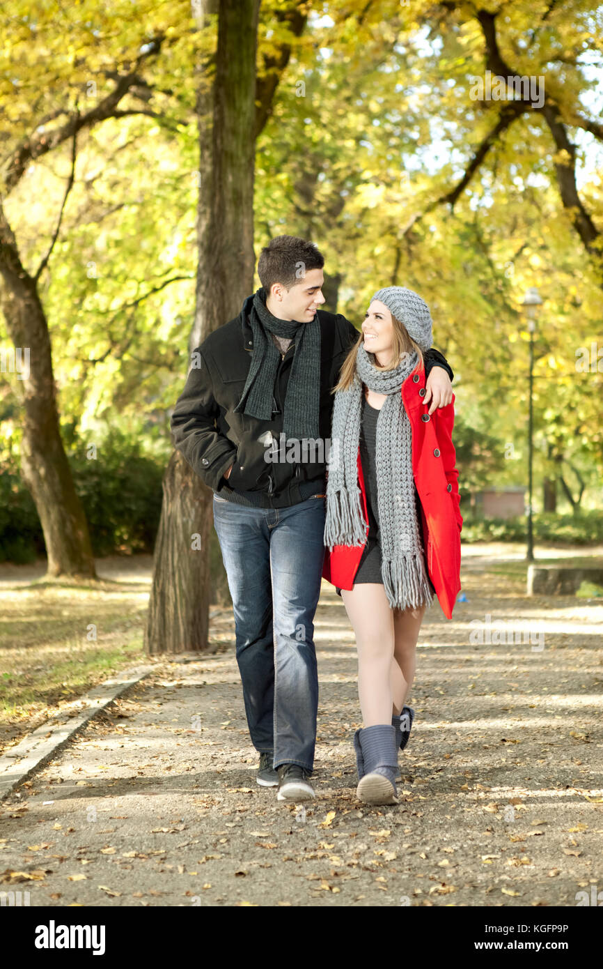 love couple walking in autumn park, young romantic couple Stock Photo ...