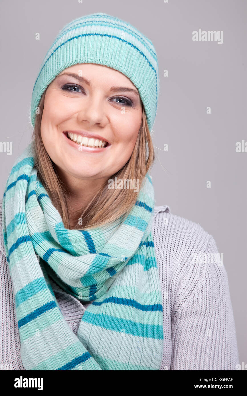 Beautiful smiling woman in blue winter clothing Stock Photo - Alamy