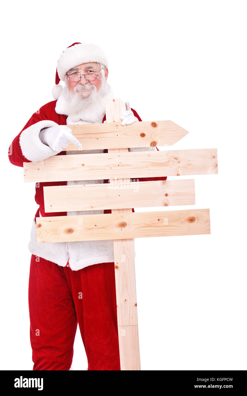 authentic Santa Claus pointing in wooden sing front him, isolated on ...