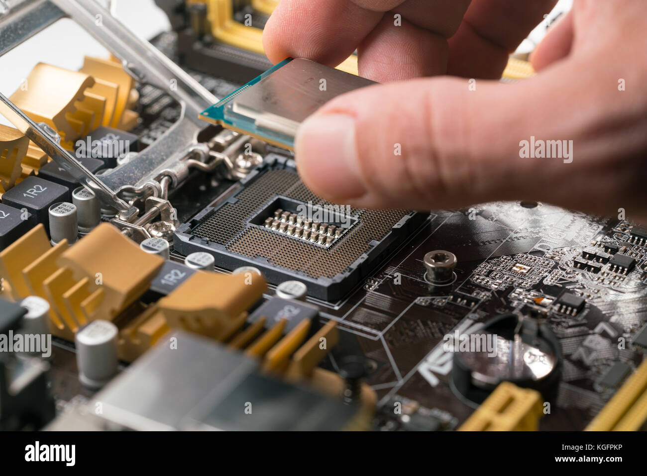 Technician plug in CPU microprocessor to motherboard socket Stock Photo - Alamy