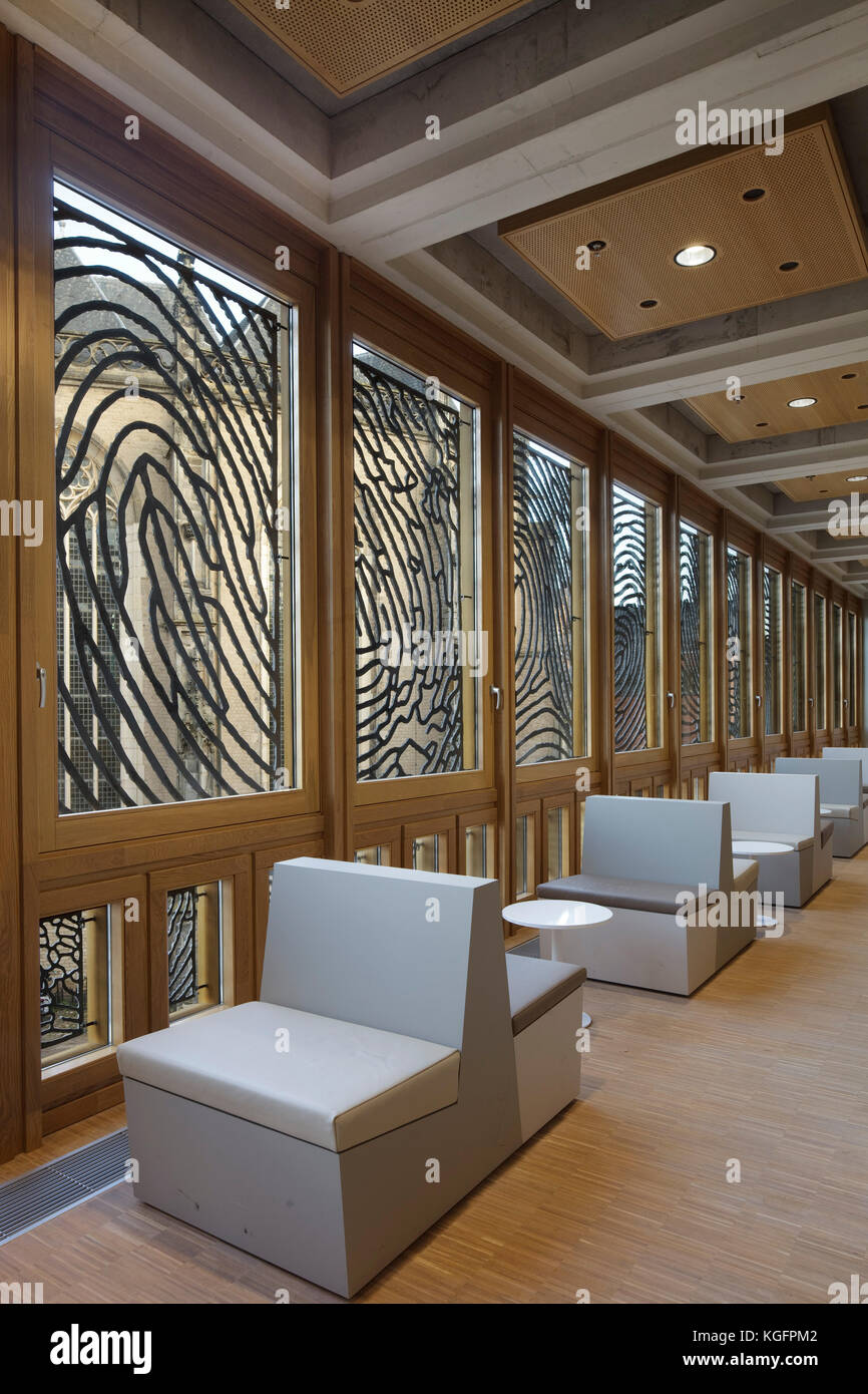 Seating in area outside restaurant with aluminium fingerprint panels ...