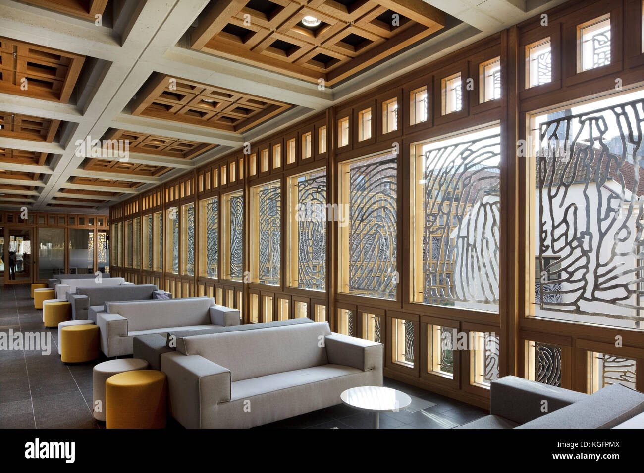 Seating in area outside restaurant with aluminium fingerprint panels in ...