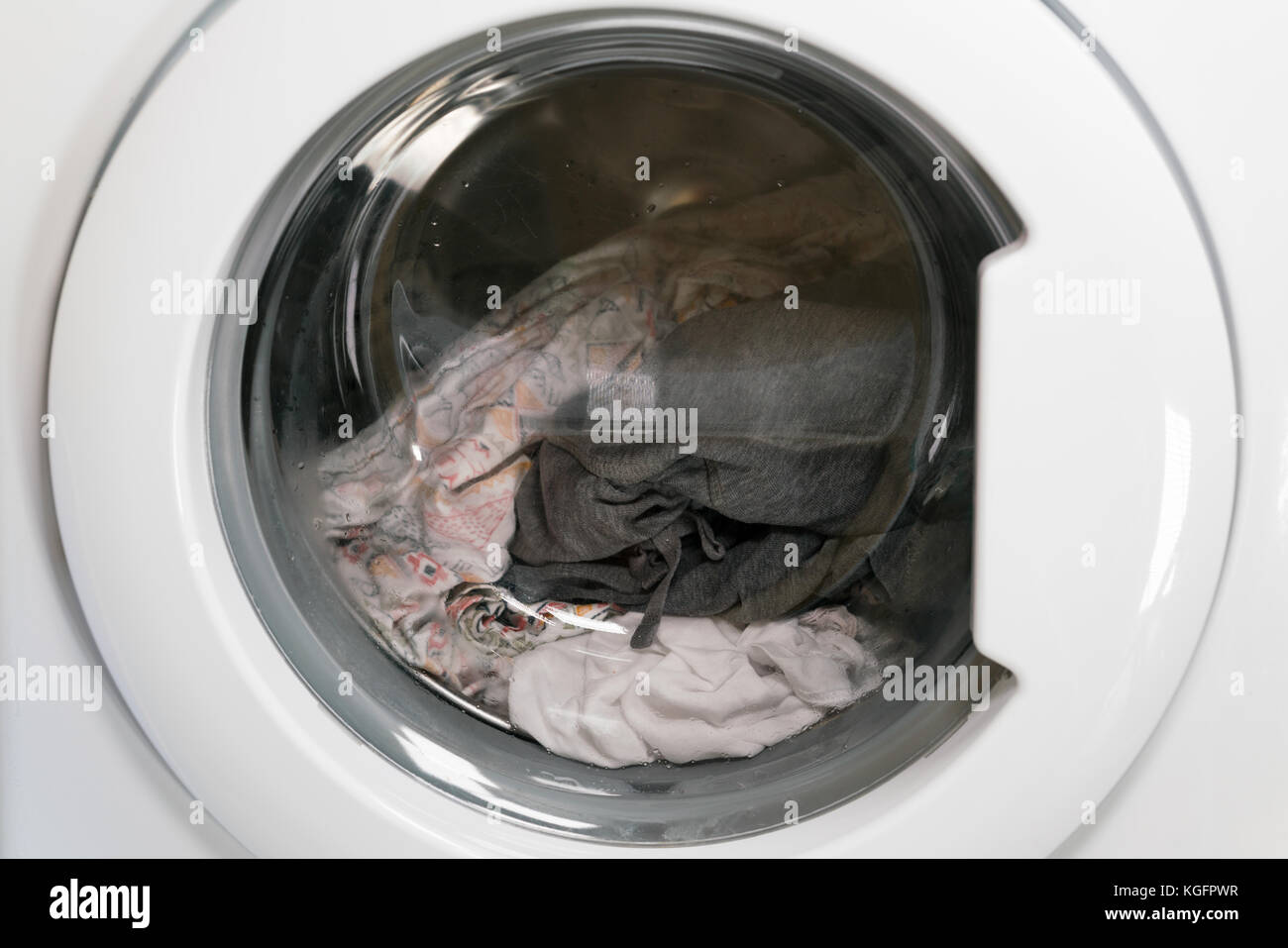 Washing machine is washing clothes Stock Photo - Alamy