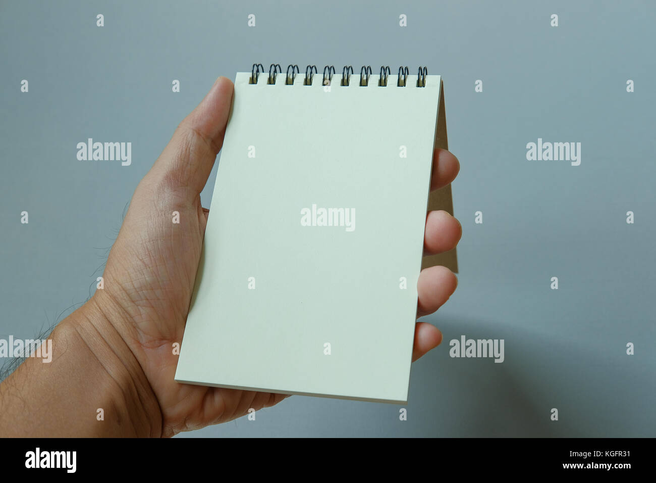 Hold notebook hi-res stock photography and images - Alamy