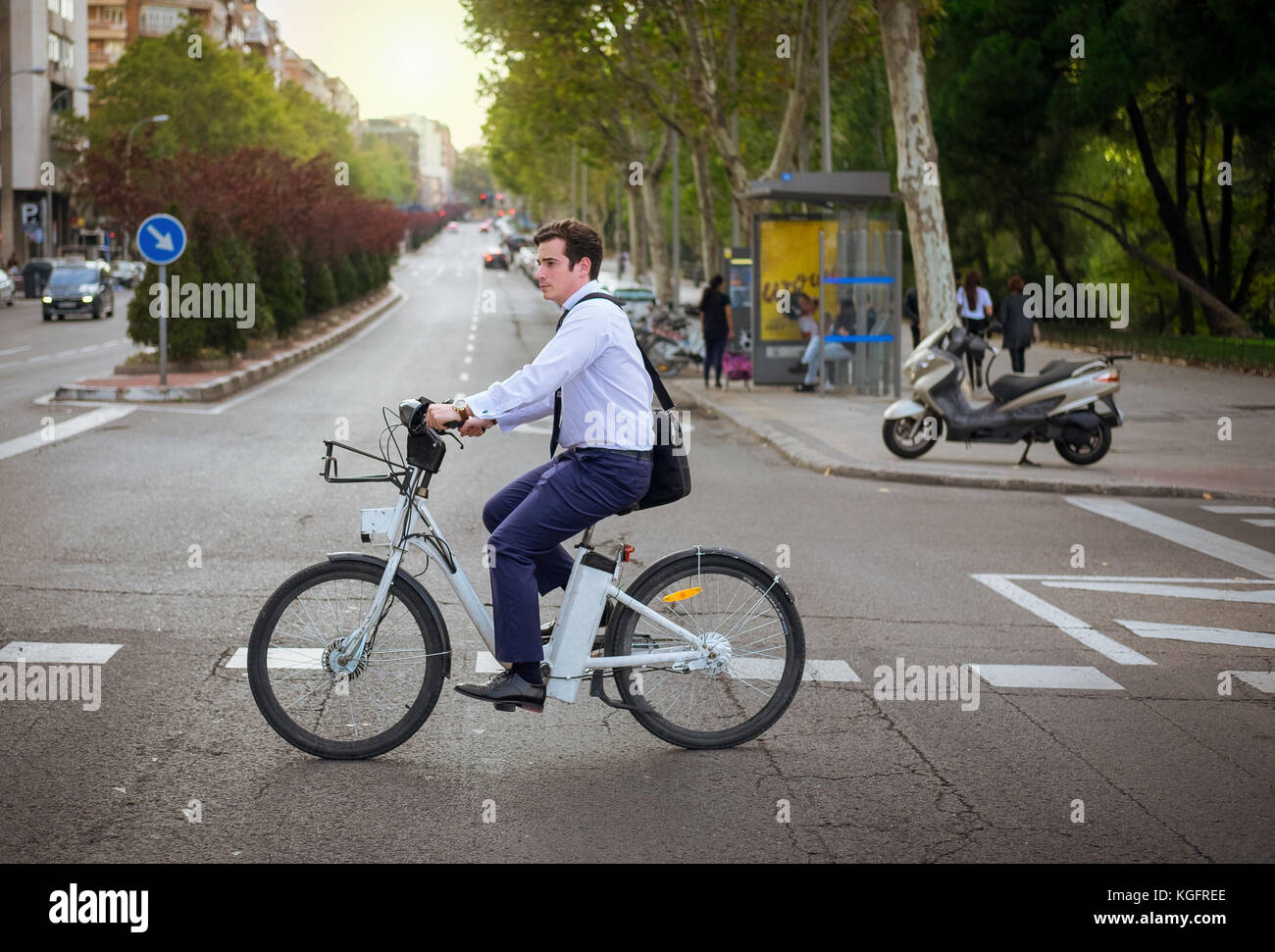 Young businessman riding a bike to work in the city Stock Photo - Alamy