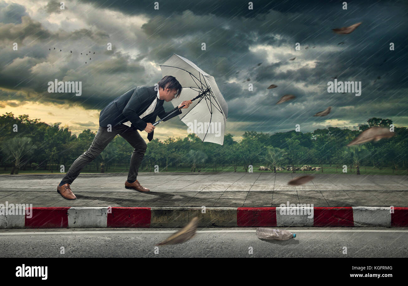 Umbrella struggle hi-res stock photography and images - Alamy