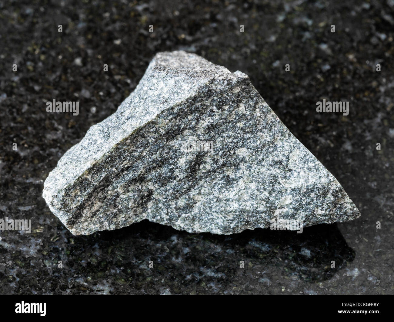 macro shooting of natural mineral rock specimen - raw olivinite stone ...