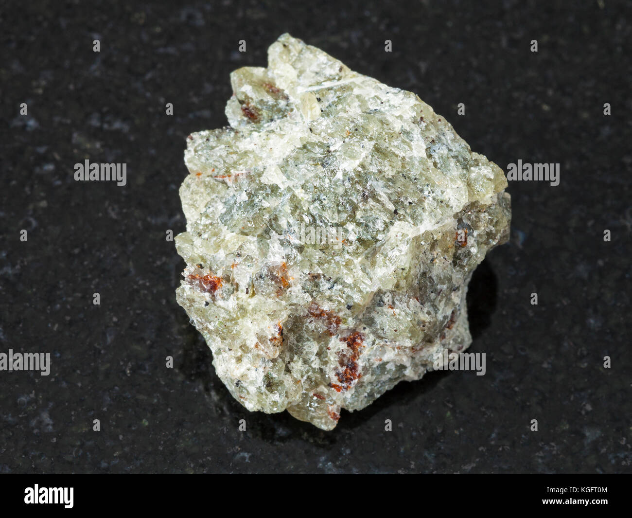 macro shooting of natural mineral rock specimen - raw olivine stone on ...