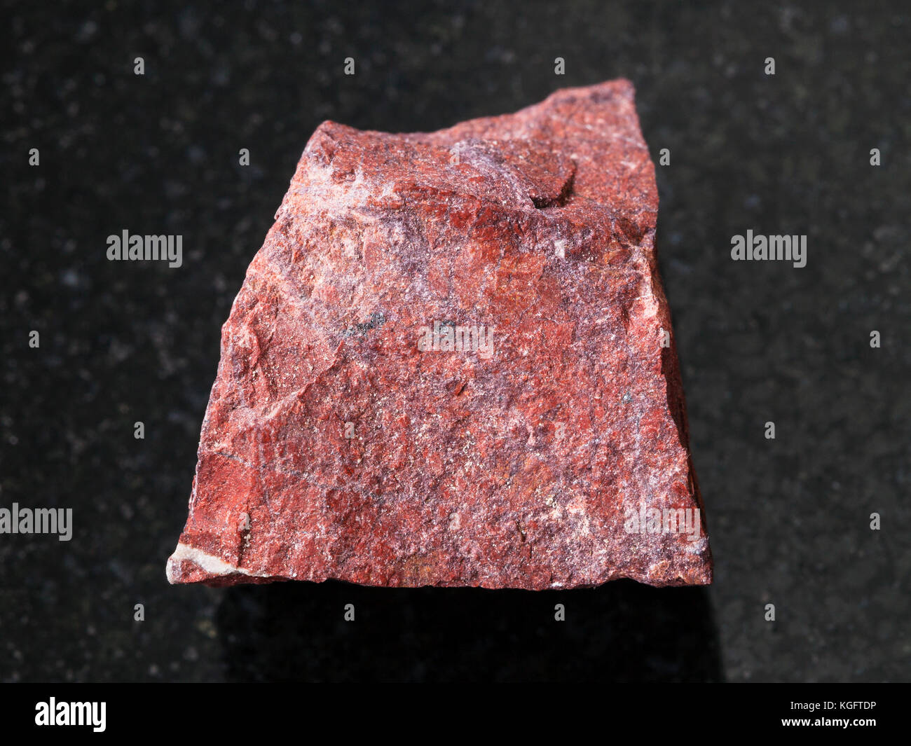 macro shooting of natural mineral rock specimen - rough red jasper ...
