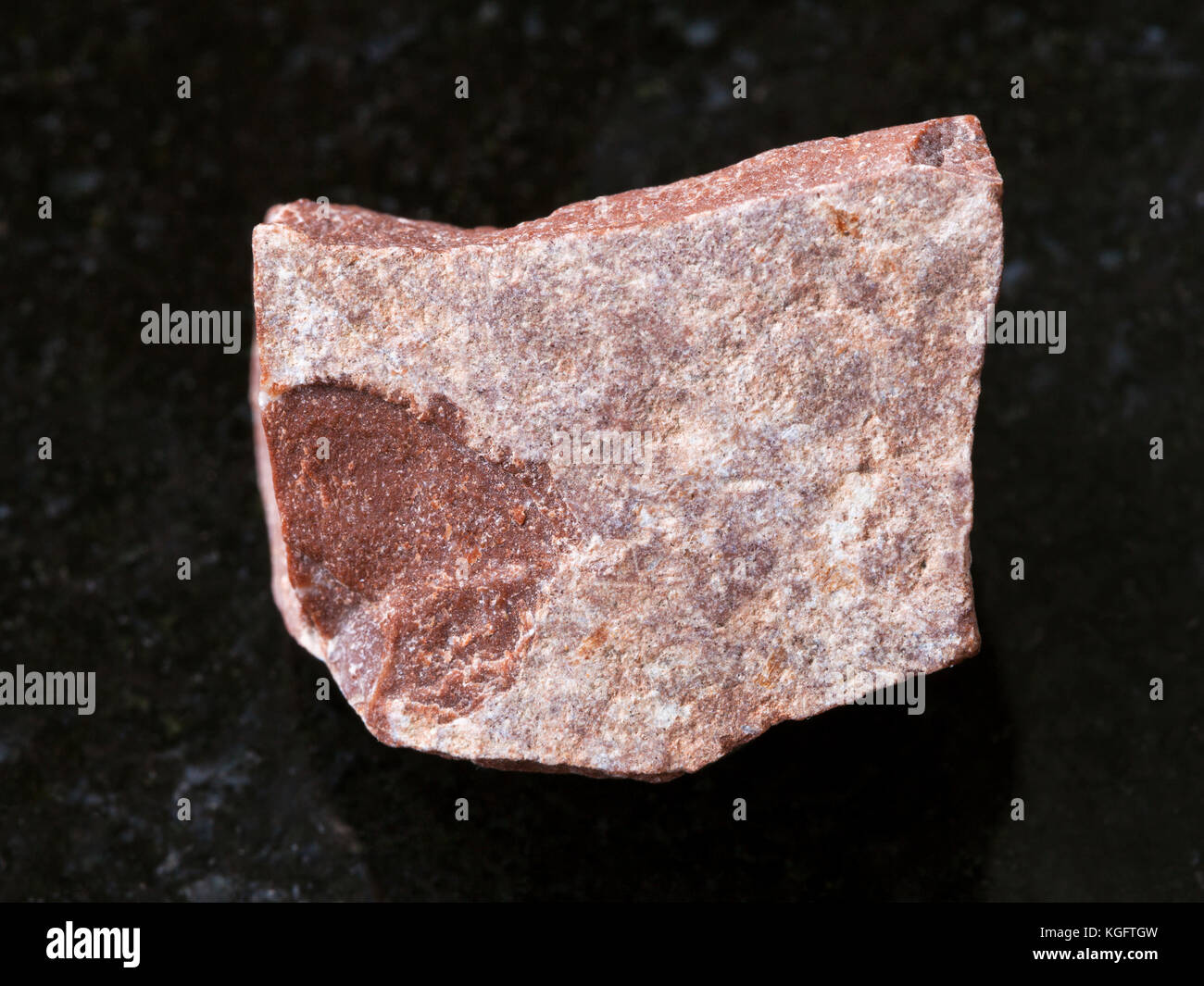 macro shooting of natural mineral rock specimen - piece of raw red ...