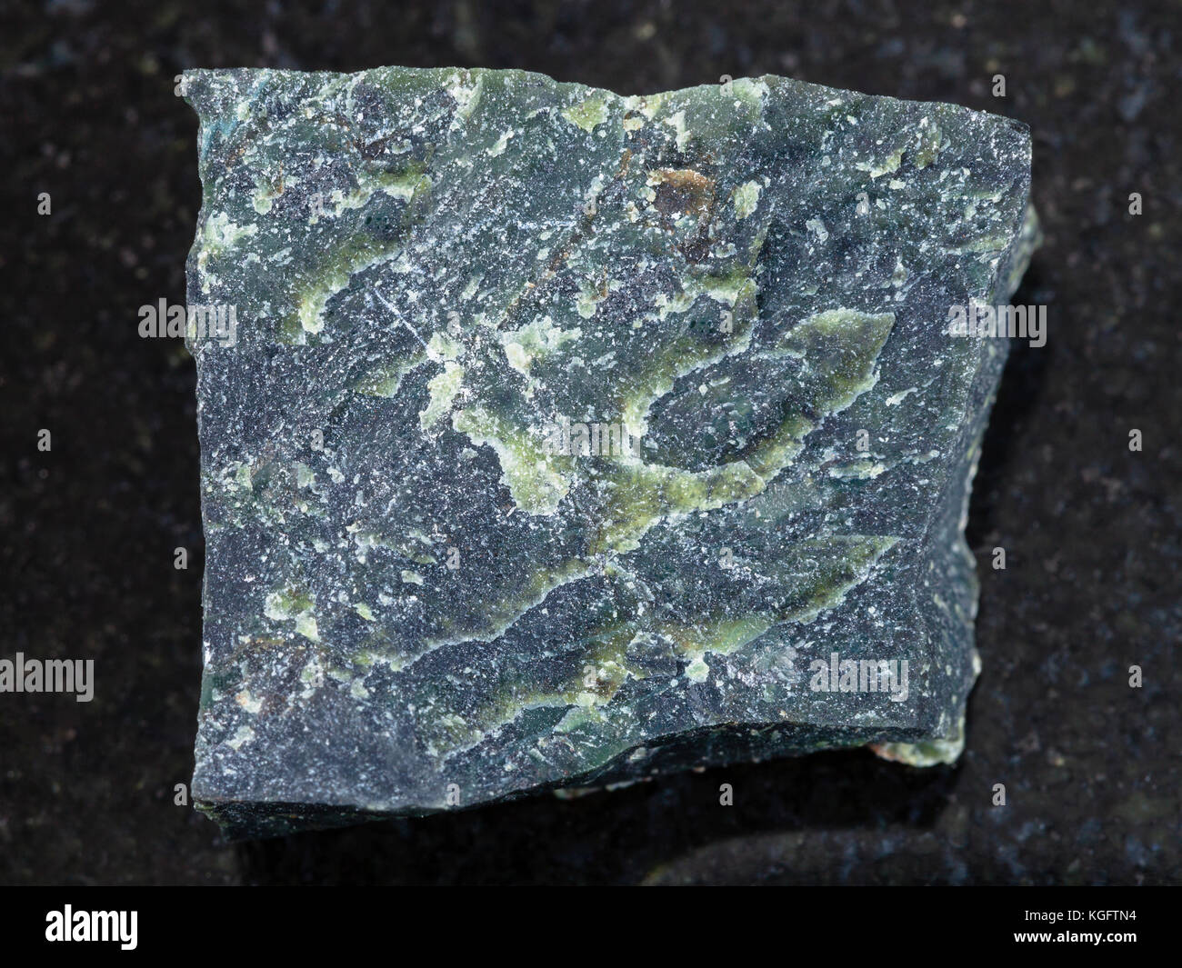 macro shooting of natural mineral rock specimen - rough dunite stone on ...