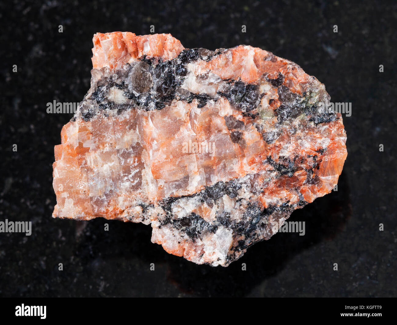macro shooting of natural mineral rock specimen - rough red granite ...