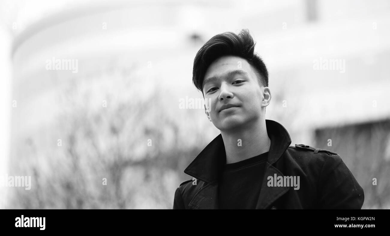 Black White photo of Asian young man outdoors posing Stock Photo - Alamy