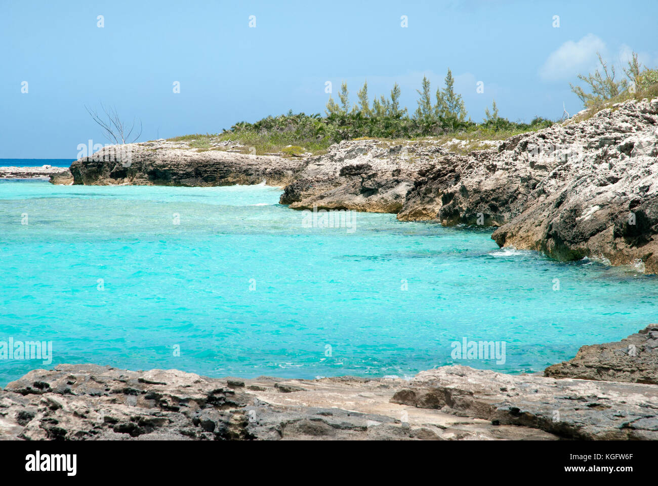 The rocky coastline and transparent water of uninhabited island Half ...
