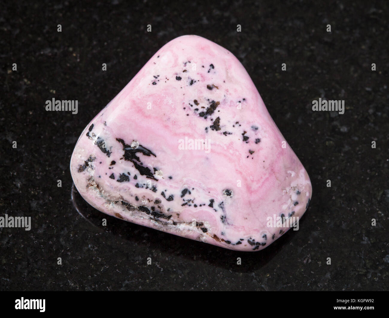 macro shooting of natural mineral rock specimen - raw rhodochrosite gem ...