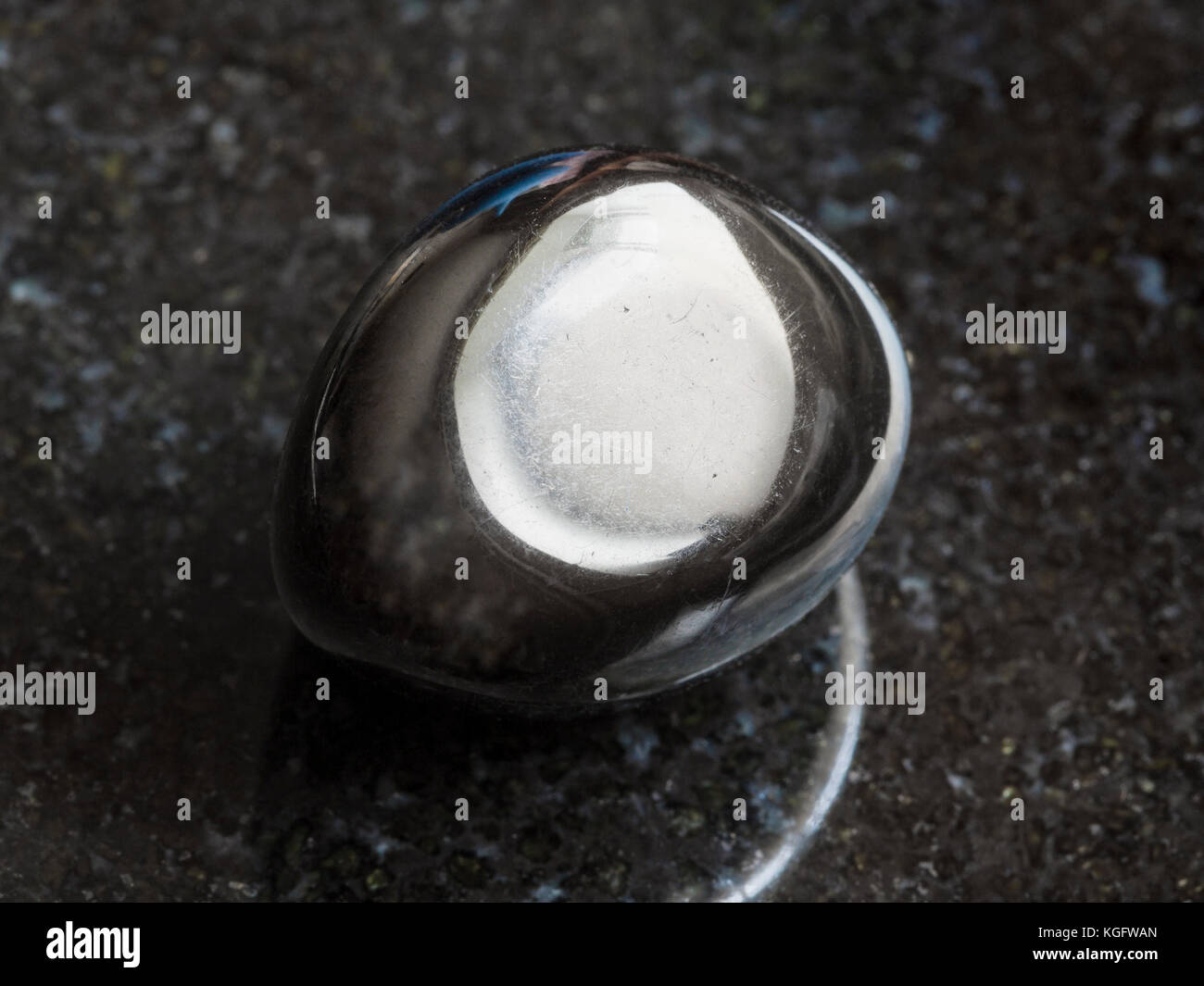 macro shooting of natural mineral rock specimen - tumbled Gagate (Jet ...