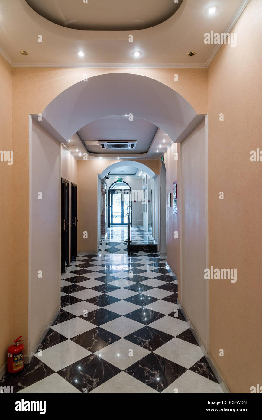 Corridor with marble floor in hotel Stock Photo - Alamy