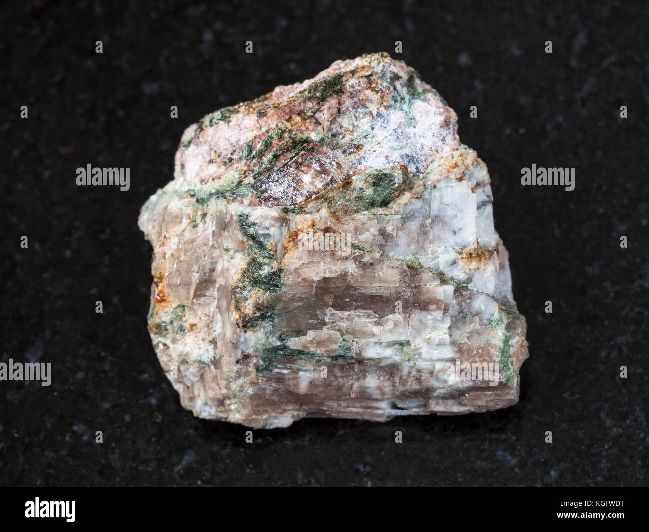 macro shooting of natural mineral rock specimen - rough Delhayelite ...