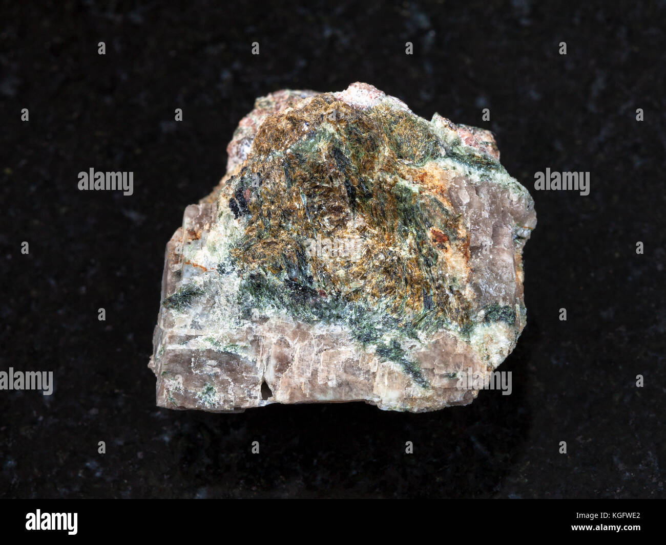 macro shooting of natural mineral rock specimen - raw Delhayelite stone ...