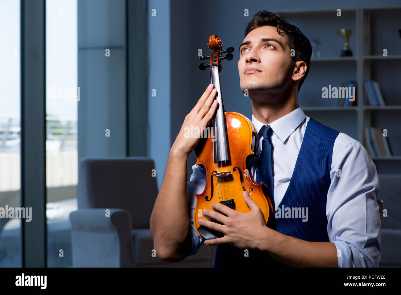 Young musician man practicing playing violin at home Stock Photo - Alamy