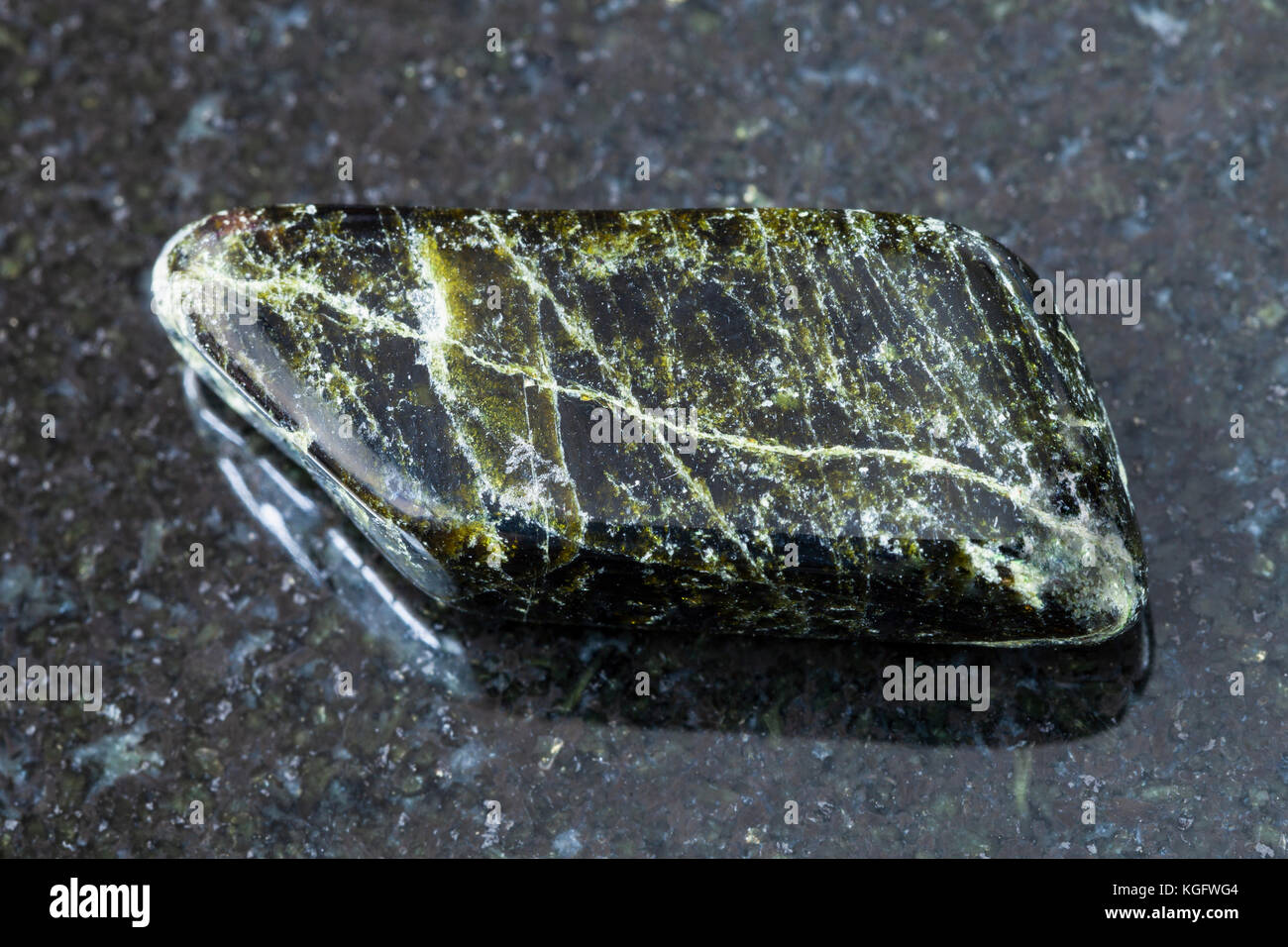 macro shooting of natural mineral rock specimen - tumbled Diopside ...