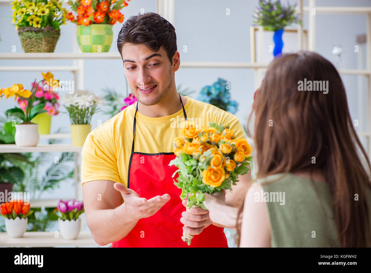 Florist selling flowers in a flower shop Stock Photo - Alamy