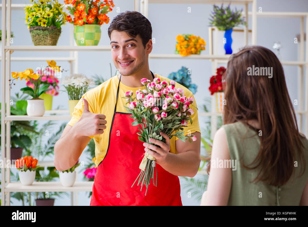 Florist selling flowers in a flower shop Stock Photo - Alamy