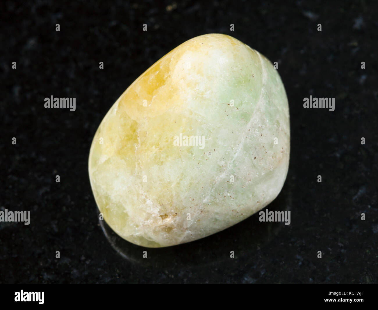 macro shooting of natural mineral rock specimen - tumbled Datolite ...