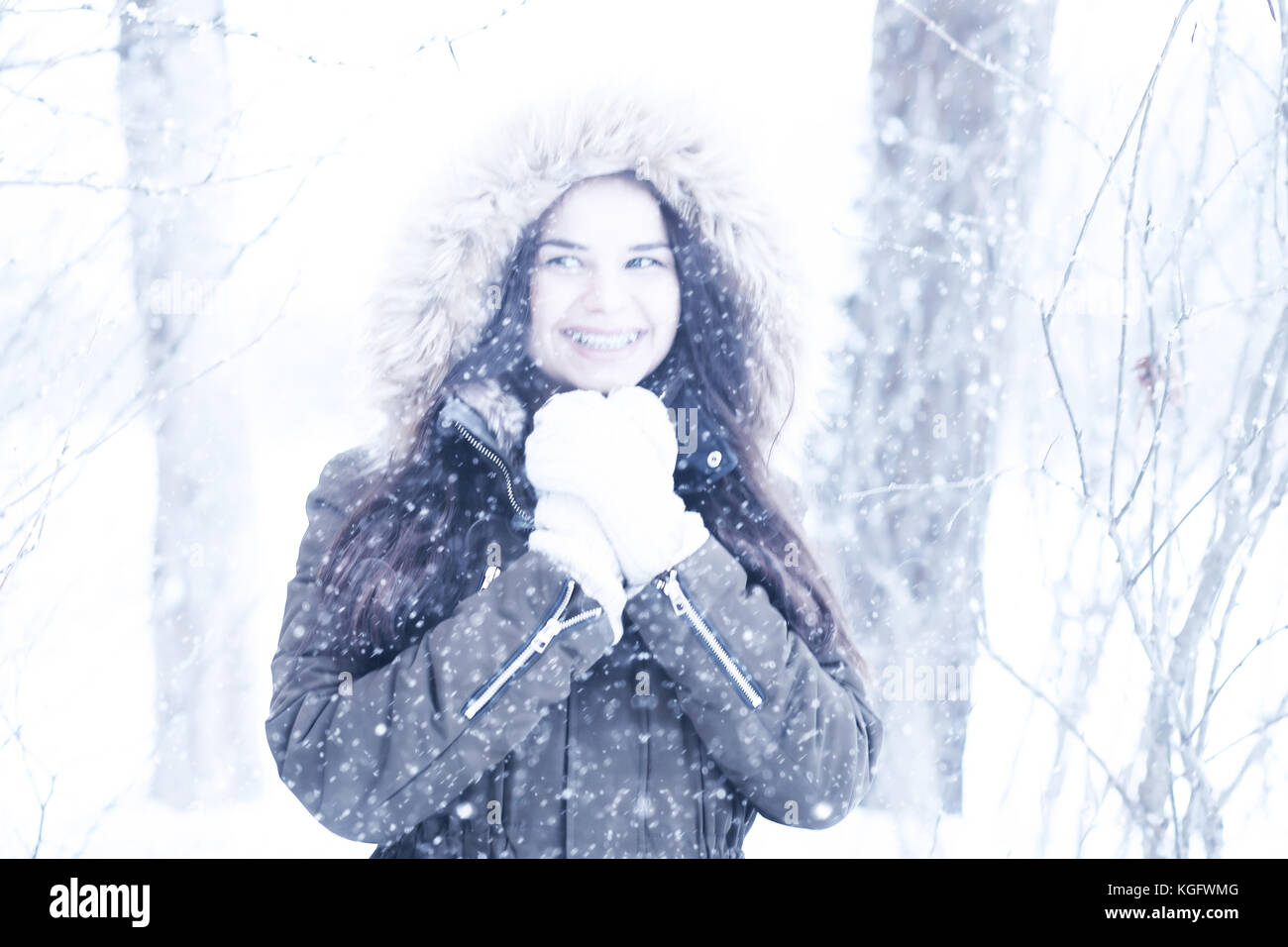 Beautiful girl in a beautiful winter snow Stock Photo - Alamy