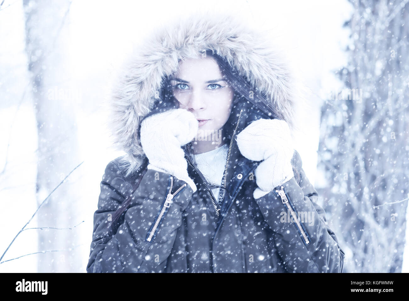 Beautiful girl in a beautiful winter snow Stock Photo - Alamy