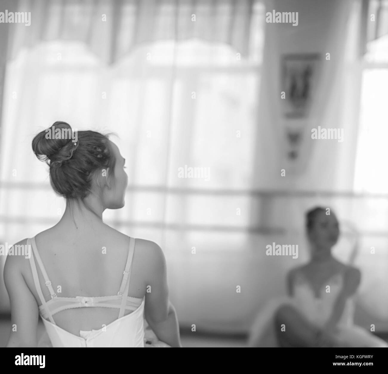 Young ballet dancer on a warm-up. The ballerina is preparing to Stock ...