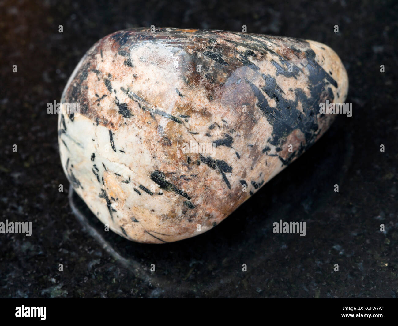 macro shooting of natural mineral rock specimen - black fibrous ...