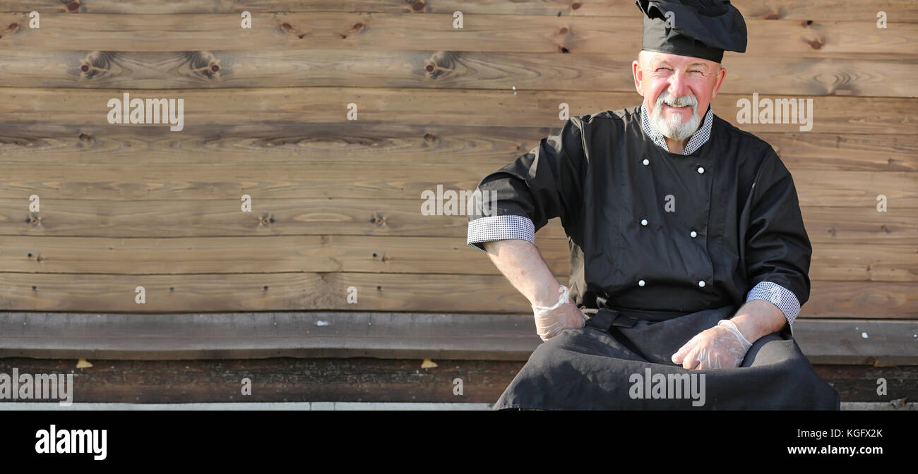 Chef old in uniform with vegetables Stock Photo - Alamy