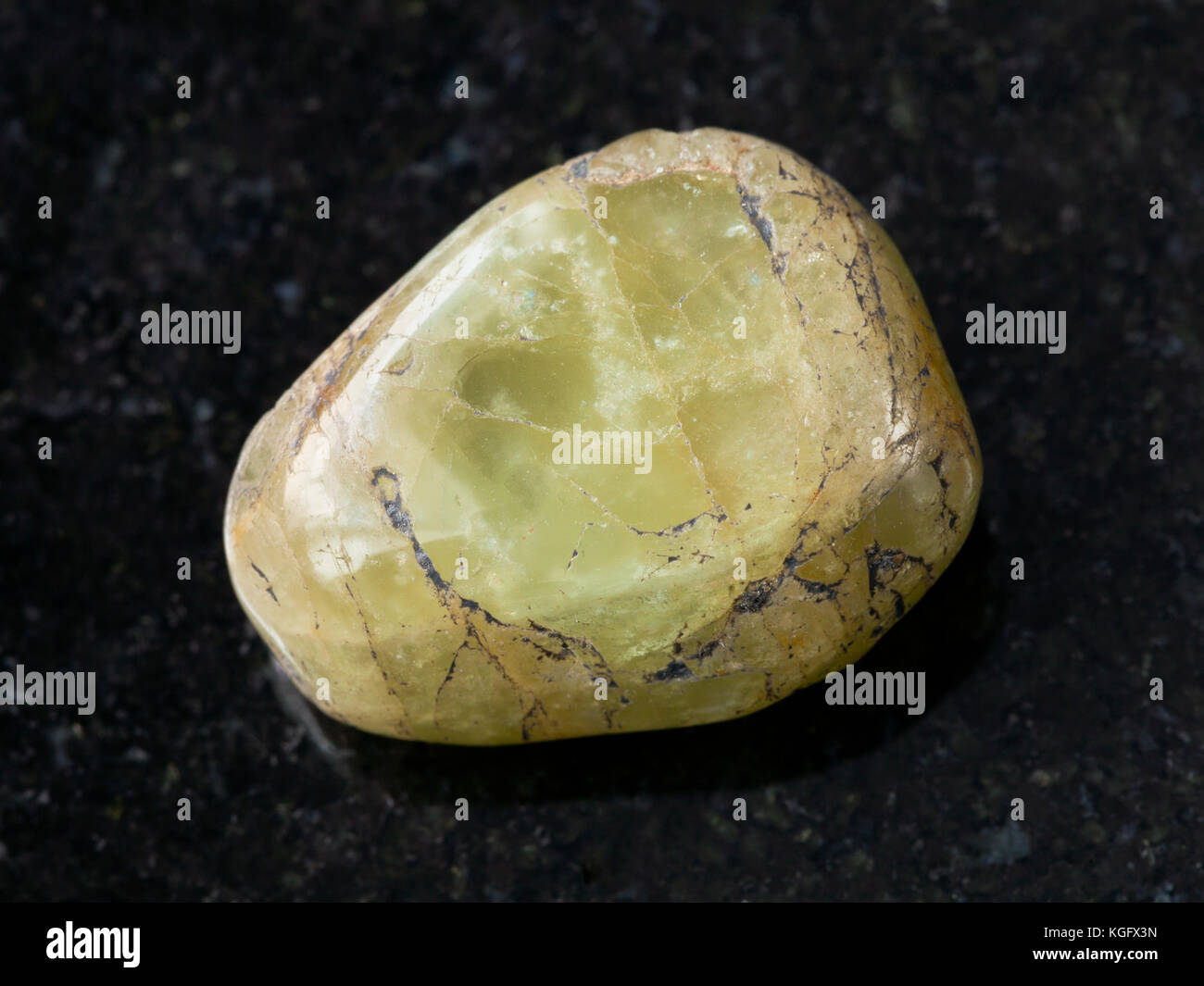 macro shooting of natural mineral rock specimen - tumbled green beryl ...