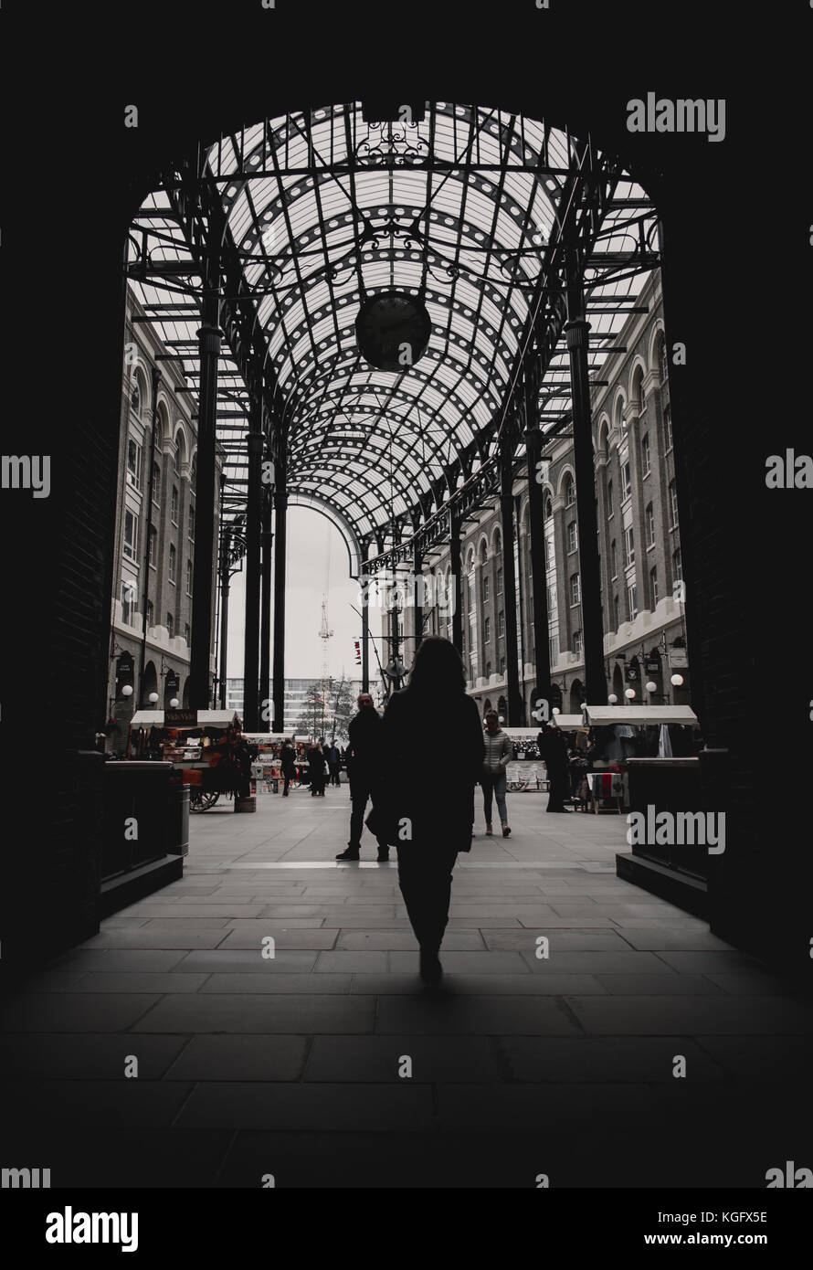 Woman walking through the shadows Stock Photo - Alamy