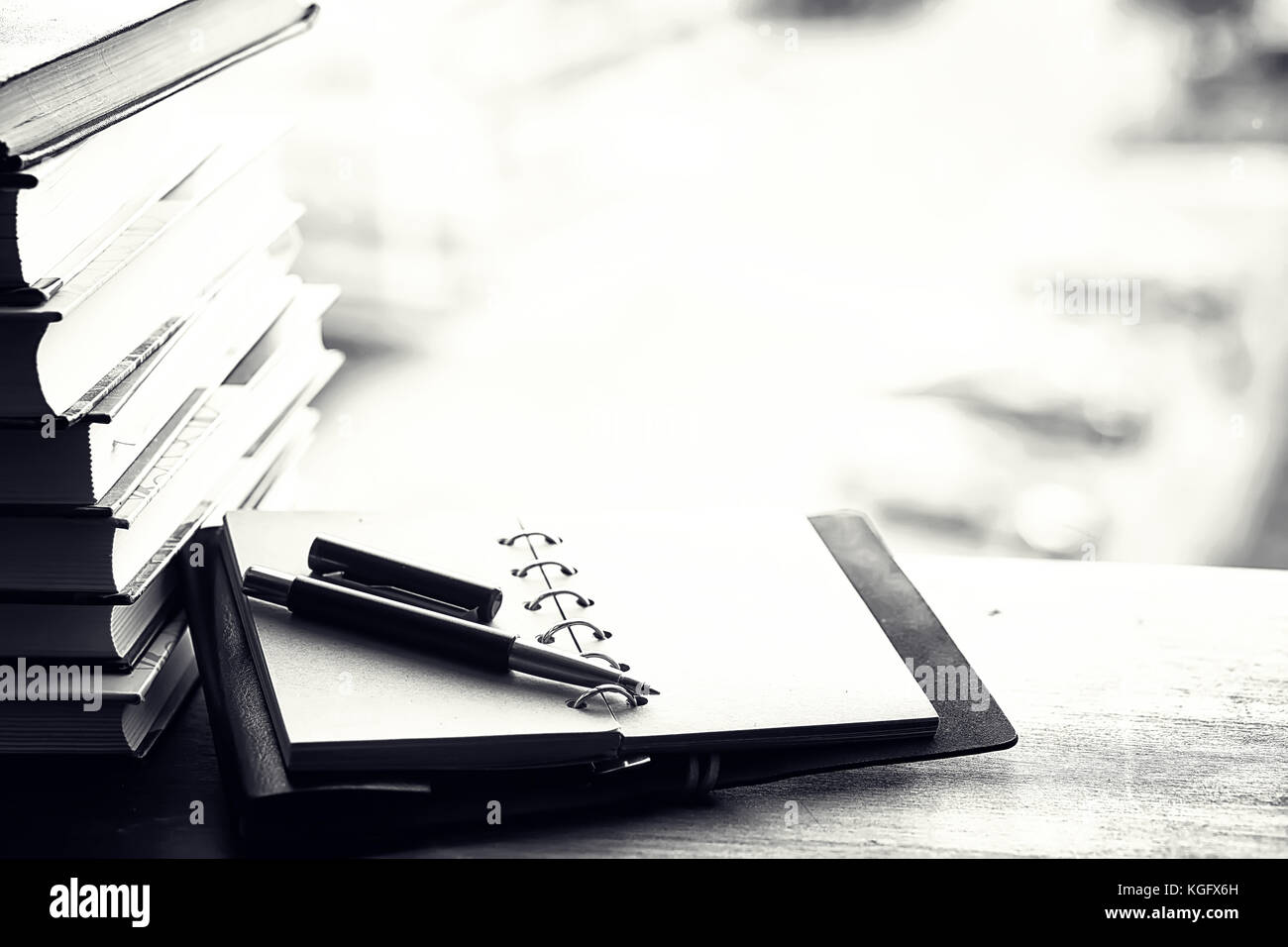 A stack of textbooks on a table Stock Photo - Alamy